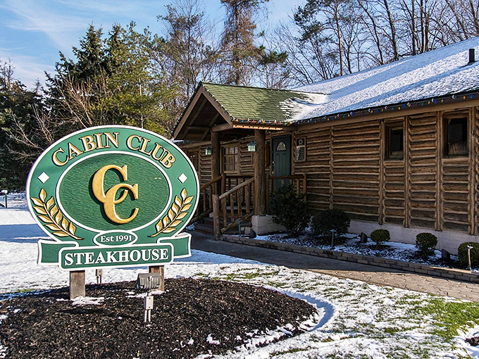 The rustic log cabin exterior of Cabin Club isn't just charming—it's a promise of the cozy, wood-scented culinary adventure waiting inside.