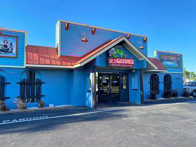 The vibrant turquoise exterior of RJ Gator's stands out like a peacock at a chicken convention, promising Florida flavors with every shade of blue.