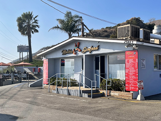 The unassuming white exterior of Malibu Seafood belies the culinary treasures within—where ocean views and fresh catches create California coastal magic.