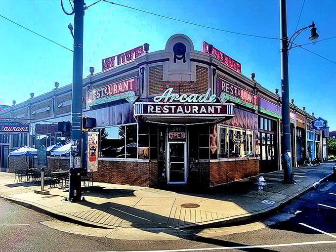 That mint green script against classic red tile isn't just a sign—it's a time machine disguised as Memphis's oldest café. Some neon just speaks to your soul.