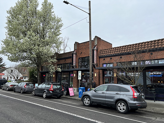 The brick façade of Cadillac Café stands proudly on a sunny Portland day, promising breakfast delights behind those welcoming doors.