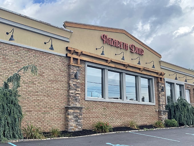 The brick façade and distinctive red signage of Nazareth Diner stands as a beacon for hungry travelers. Pennsylvania comfort food has found its perfect home.