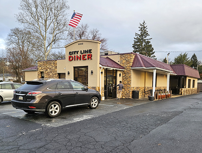 Stone facade, American flag, and that iconic red sign – City Line Diner stands like a delicious fortress of comfort food in Harrisburg.
