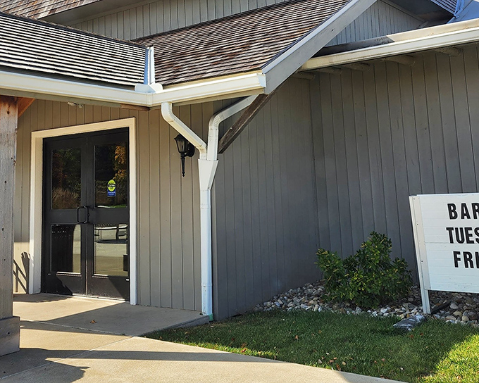 The charming exterior of Sauder Village welcomes visitors with classic white buildings and brick pathways—rural Ohio's version of a time machine.