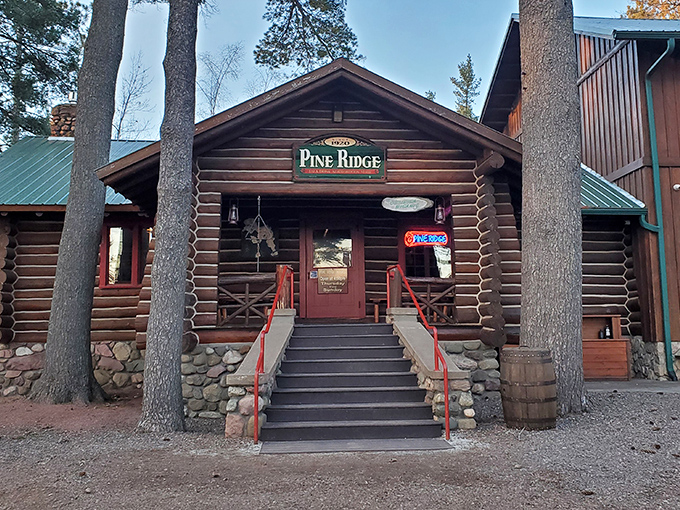 The quintessential Northwoods hideaway beckons through towering pines. This log cabin promises culinary treasures worth every mile of your journey.