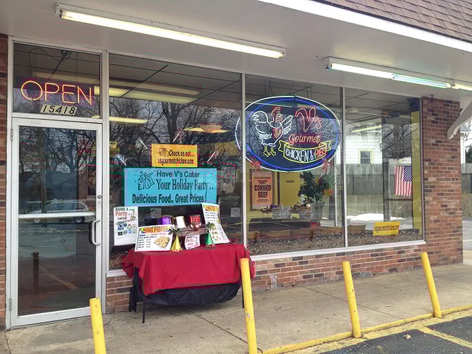 The unassuming storefront of V's Gourmet Chicken might not win architectural awards, but those yellow bollards are guarding culinary treasure that locals have cherished for years.