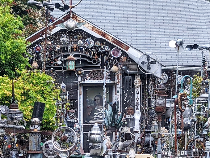 The front facade of Vanadu Art House looks like what would happen if a hardware store and a carnival had a baby that went to art school.
