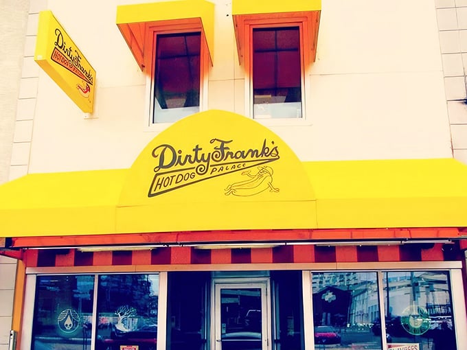 That cheerful yellow awning isn't just a sign—it's a beacon of hot dog happiness beckoning hungry Columbus wanderers to step inside and indulge.