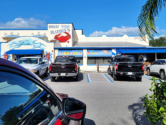 The giant blue crab guarding High Tide Harry's entrance isn't just decoration—it's a promise of the oceanic treasures waiting inside.