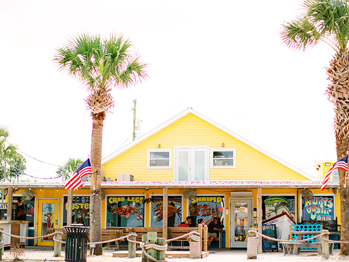 The sunshine-yellow exterior of Hunt's with its boat hull welcome sign screams "authentic Florida" louder than a pelican at feeding time.
