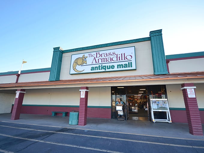The teal-trimmed facade of Brass Armadillo beckons treasure hunters with its distinctive armadillo logo—a portal to yesterday waiting to be explored.