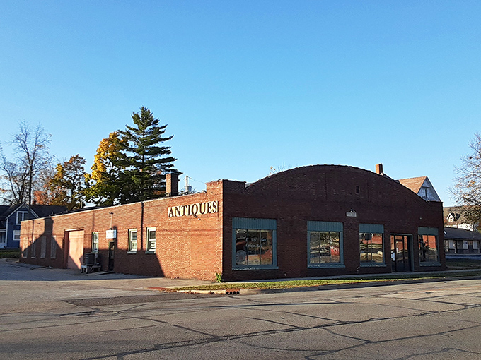 The unassuming brick exterior houses a universe of treasures inside—like finding Narnia in a closet, but with more vintage toasters.
