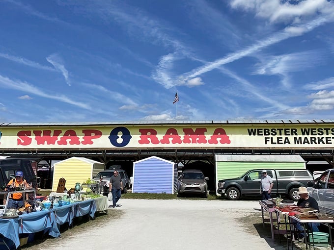 The iconic Swap-O-Rama sign welcomes treasure hunters under Florida's brilliant blue sky, promising adventures in bargain hunting beyond its gates.