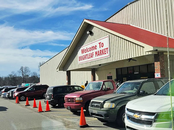 The red-trimmed entrance to Brightleaf Market stands like a beacon of bargain possibilities under Carolina's blue skies. Adventure awaits inside!