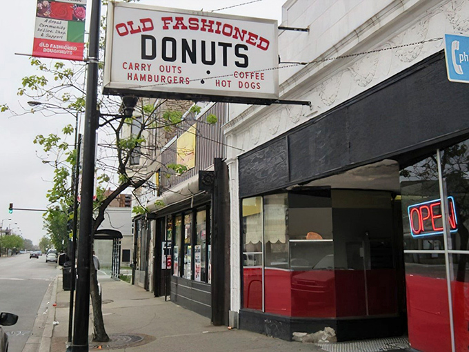 The vintage sign says it all – donuts, carry-outs, hamburgers, hot dogs. In Chicago's Roseland neighborhood, this isn't just breakfast; it's an institution.