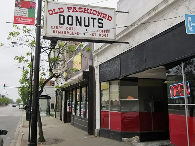 The vintage sign says it all – donuts, carry-outs, hamburgers, hot dogs. In Chicago's Roseland neighborhood, this isn't just breakfast; it's an institution.