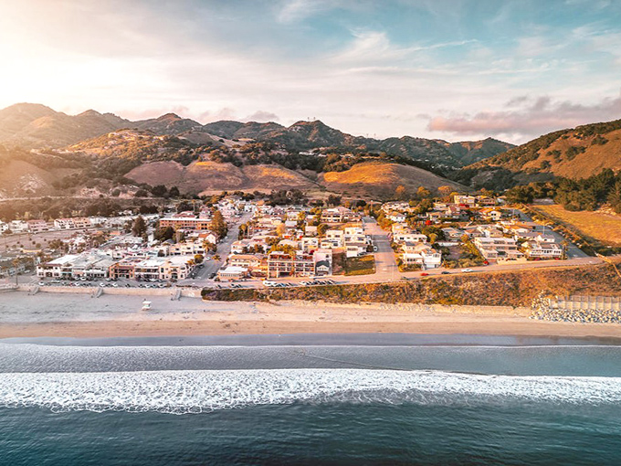 Avila Beach unfolds like a Mediterranean daydream, where golden hills embrace a perfect crescent of sand and sea. California coastal living at its most picturesque.