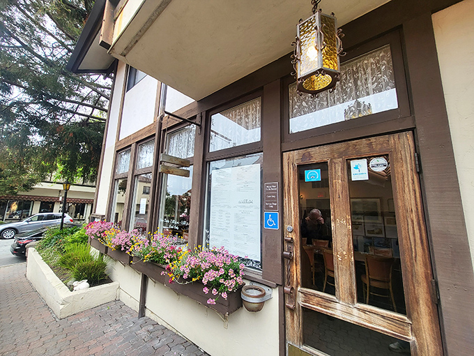 The charming exterior of Katy's Place welcomes you with colorful flower boxes and rustic wooden doors – Carmel's breakfast paradise hiding in plain sight.