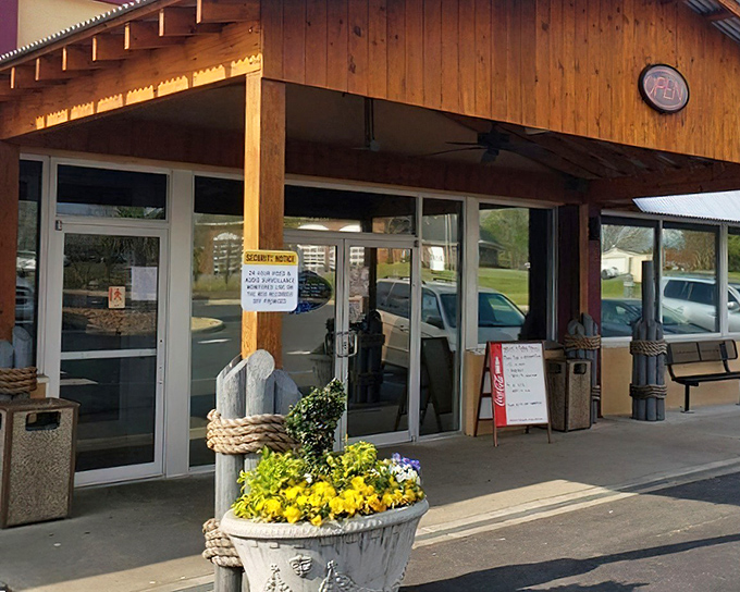 The rustic wooden exterior of Captain Steve's welcomes seafood lovers with cheerful yellow flowers and nautical charm—a landlocked lighthouse for hungry sailors.