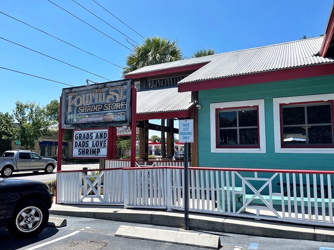 The mint-green exterior with its weathered "Grads and Dads Love Shrimp" sign promises Florida seafood authenticity without pretense. No designer consultants were harmed in the making of this restaurant.