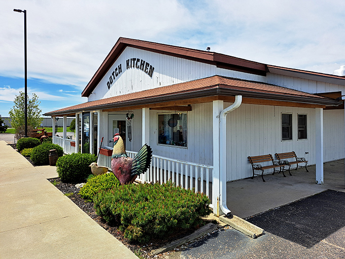 The unassuming white exterior of Dutch Village Restaurant stands like a beacon of breakfast hope in Nappanee, promising homestyle delights without any fancy pretensions.