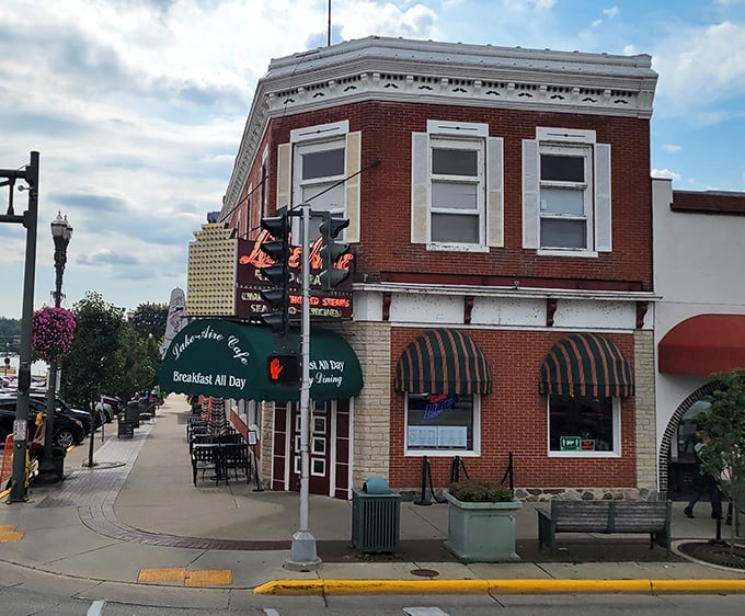 That classic brick facade and green awning whisper promises of breakfast perfection waiting inside.