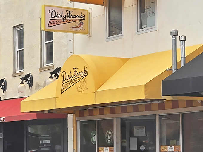 That cheerful yellow awning isn't just a sign—it's a beacon of hot dog happiness beckoning hungry Columbus wanderers to step inside and indulge.
