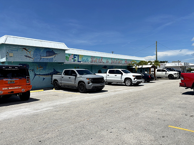 The turquoise exterior isn't just Florida kitsch—it's a maritime beacon for hungry travelers. Painted fish swim eternally across walls that have witnessed countless seafood pilgrimages.