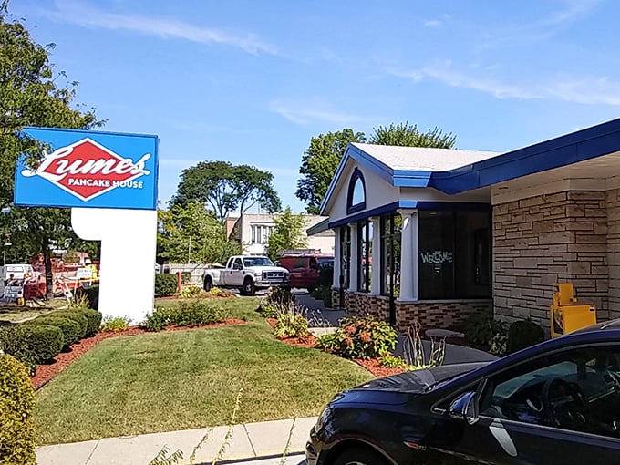 The blue-trimmed exterior of Lumes stands like a beacon of breakfast hope, promising pancake perfection before you even step inside.