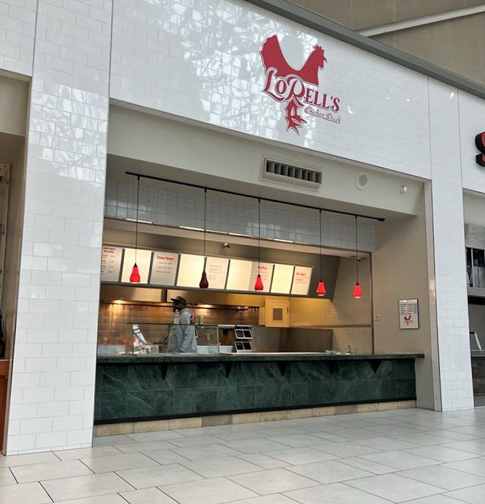 The iconic red chicken logo of LoRell's beckons from its clean, minimalist storefront—proof that greatness doesn't need flashy advertising.