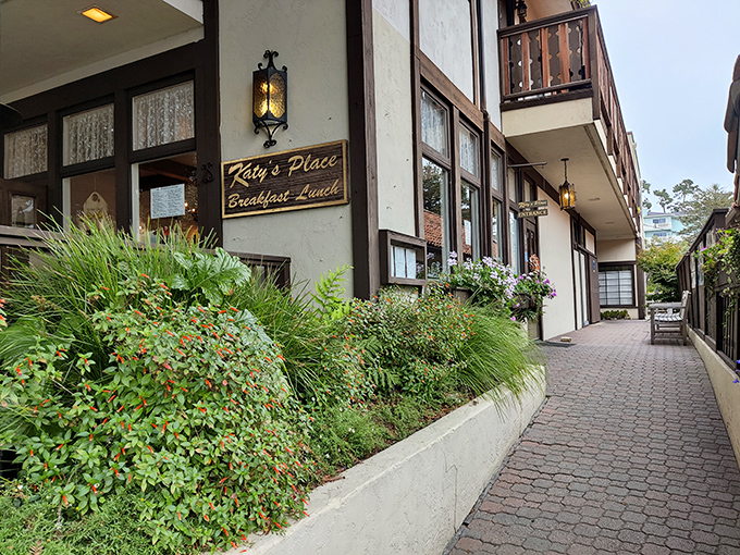 The charming exterior of Katy's Place welcomes you with colorful flower boxes and rustic wooden doors – Carmel's breakfast paradise hiding in plain sight.