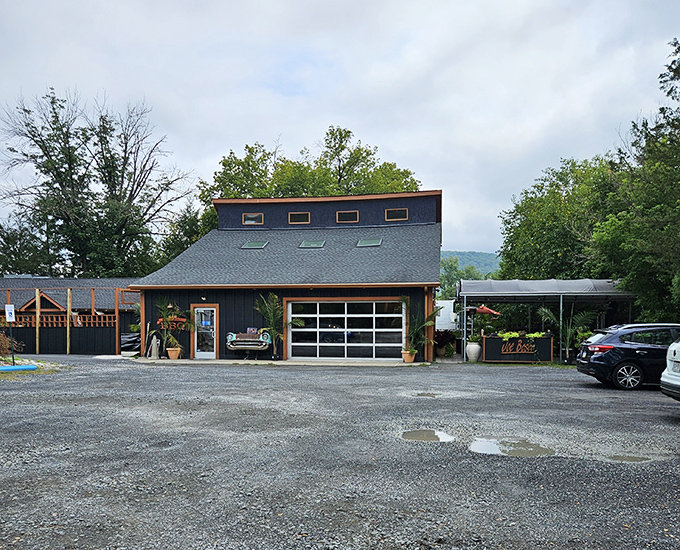 The classic car front boldly mounted on this blue-gray exterior isn't just decoration—it's a promise that something timelessly delicious awaits inside.