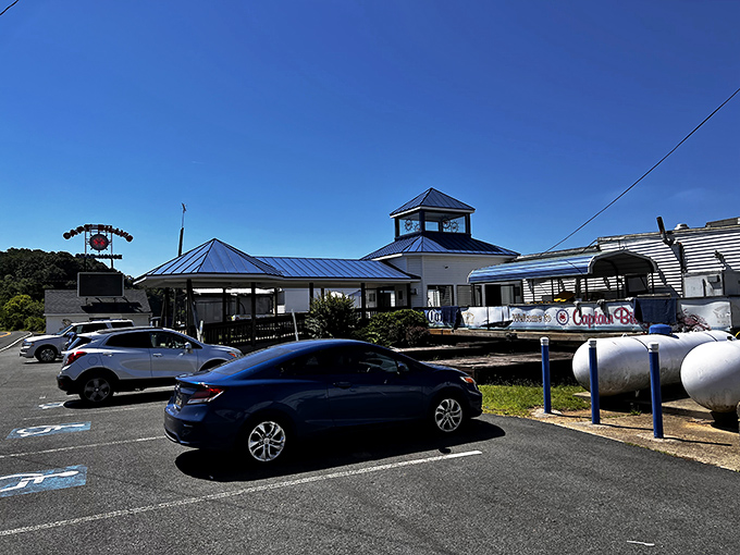 The iconic roadside sign beckons like a siren call to seafood lovers – Captain Billy's stands ready to welcome hungry travelers to crab paradise.
