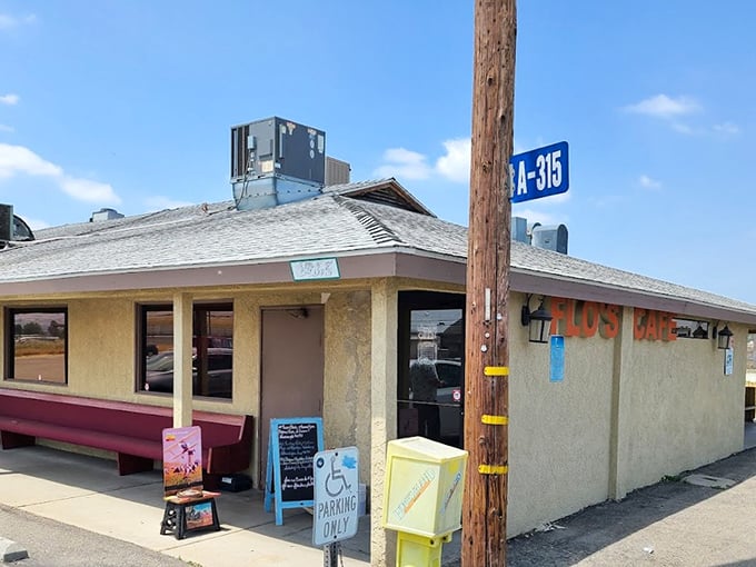 The unassuming exterior of Flo's Airport Cafe stands like a time capsule at Chino Airport, promising comfort food that's been fueling pilots and locals for generations.