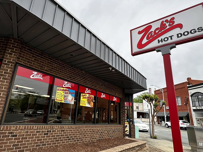 That red and white exterior isn't just signage – it's a beacon calling hungry souls to hot dog heaven.