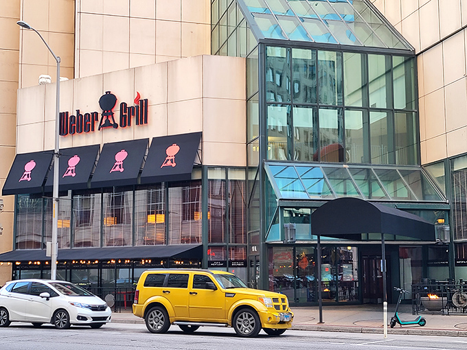 The iconic Weber Grill Restaurant stands proudly in downtown Indianapolis, its distinctive awnings featuring the silhouette of their famous kettle grills.