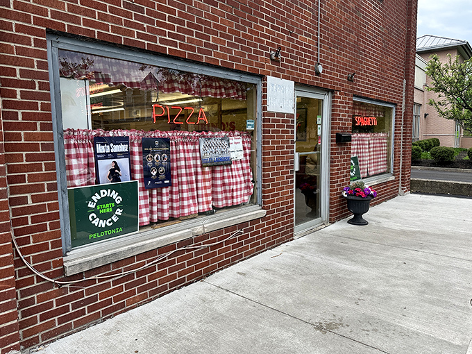 The neon glow of Rubino's storefront beckons like a lighthouse for pizza pilgrims. This brick facade has witnessed decades of hungry Ohioans making their pizza pilgrimages.