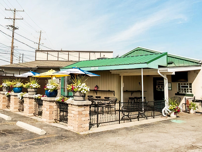 Not all treasures wear fancy packaging! India Oak's modest exterior, with its charming green-trimmed roof and flower-filled patio, is Columbus's version of a culinary speakeasy.