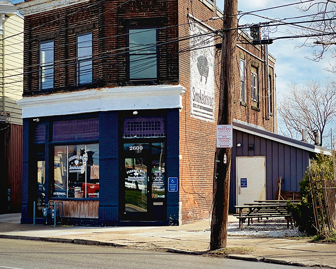 The unassuming blue corner building that houses Federal Hill Smokehouse might not look like barbecue paradise, but trust me—culinary miracles happen inside these brick walls.