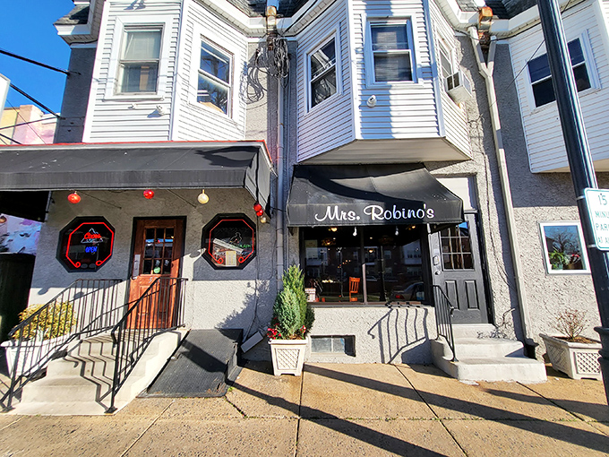 The unassuming storefront of Mrs. Robino's speaks volumes – behind that classic sign and black awning lies decades of Delaware culinary history and countless happy memories.