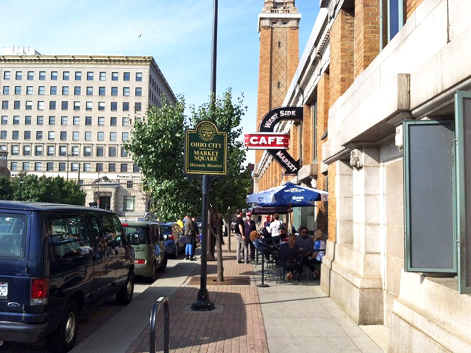 The iconic clock tower of Ohio City Market Square stands sentinel over the West Side Market Café, promising culinary adventures within those brick walls.