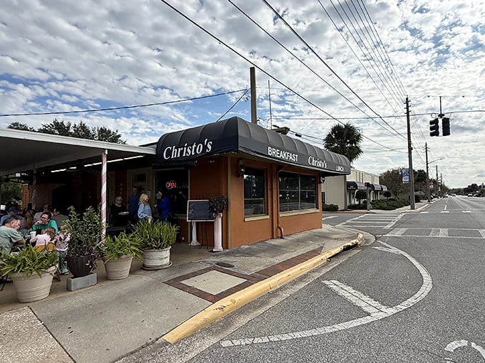 The unassuming orange brick exterior of Christo's Café stands like a beacon of breakfast hope on an Orlando corner. No fancy frills needed when the food speaks volumes.