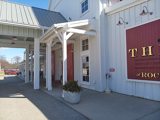 The classic red and cream exterior isn't just farm-chic window dressing—it's your first clue that serious culinary business happens inside these barn walls.