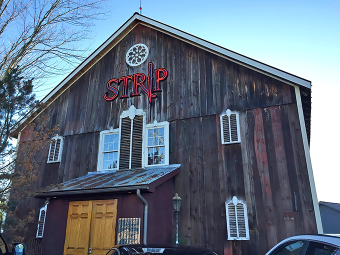 The rustic barn exterior of Strip Steakhouse stands as a delicious contradiction—fine dining hiding in plain sight among Avon's countryside charm.