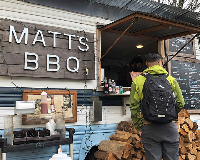 The humble blue trailer that launched a thousand BBQ pilgrimages. Matt's BBQ proves greatness doesn't require fancy digs—just wood, smoke, and patience.