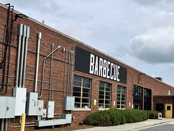 The bold "BARBECUE" declaration on this brick fortress isn't just signage—it's a promise that's kept with every smoky bite inside.
