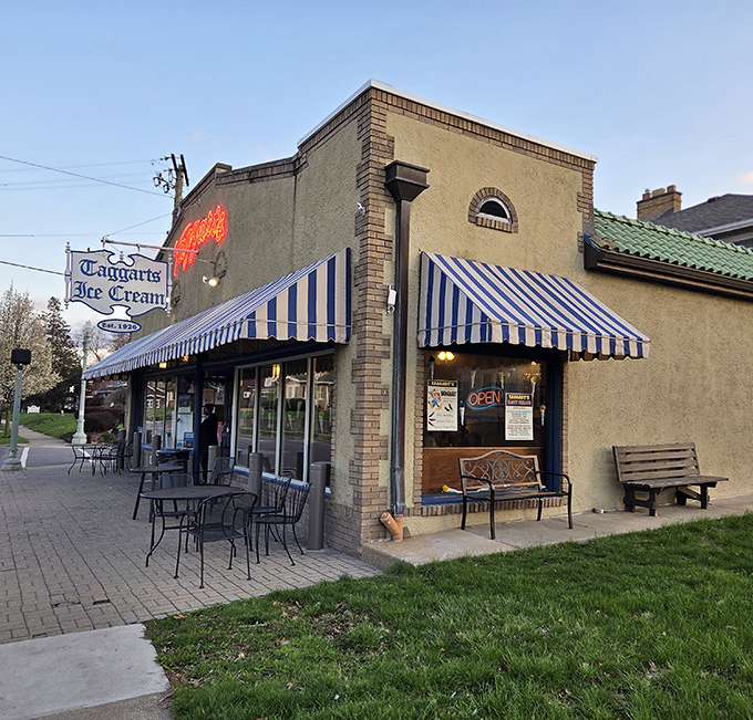 The blue and white striped awnings of Taggarts Ice Cream beckon like a sweet siren call, promising frozen treasures within this Canton landmark.