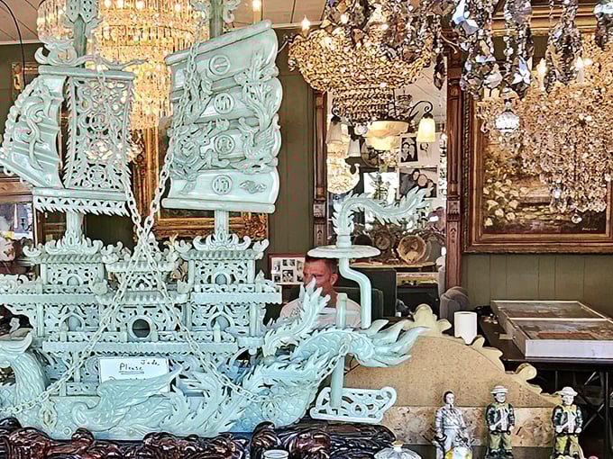 The jade dragon boat that launched a thousand "where did you find that?" conversations. Intricate craftsmanship meets showstopping color beneath a galaxy of crystal chandeliers.