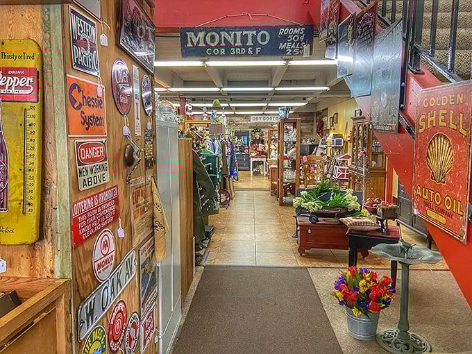 Vintage signs line the entrance corridor like a time-travel portal. Dr. Pepper thermometers and Shell Oil memorabilia welcome you to a wonderland of nostalgia.