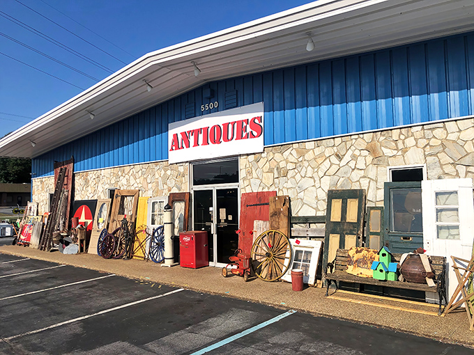 The blue facade with its bold "ANTIQUES" sign isn't just a storefront—it's a portal to decades past waiting to be explored.